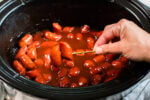 Slow Cooker Bourbon Hot Dogs - The Magical Slow Cooker